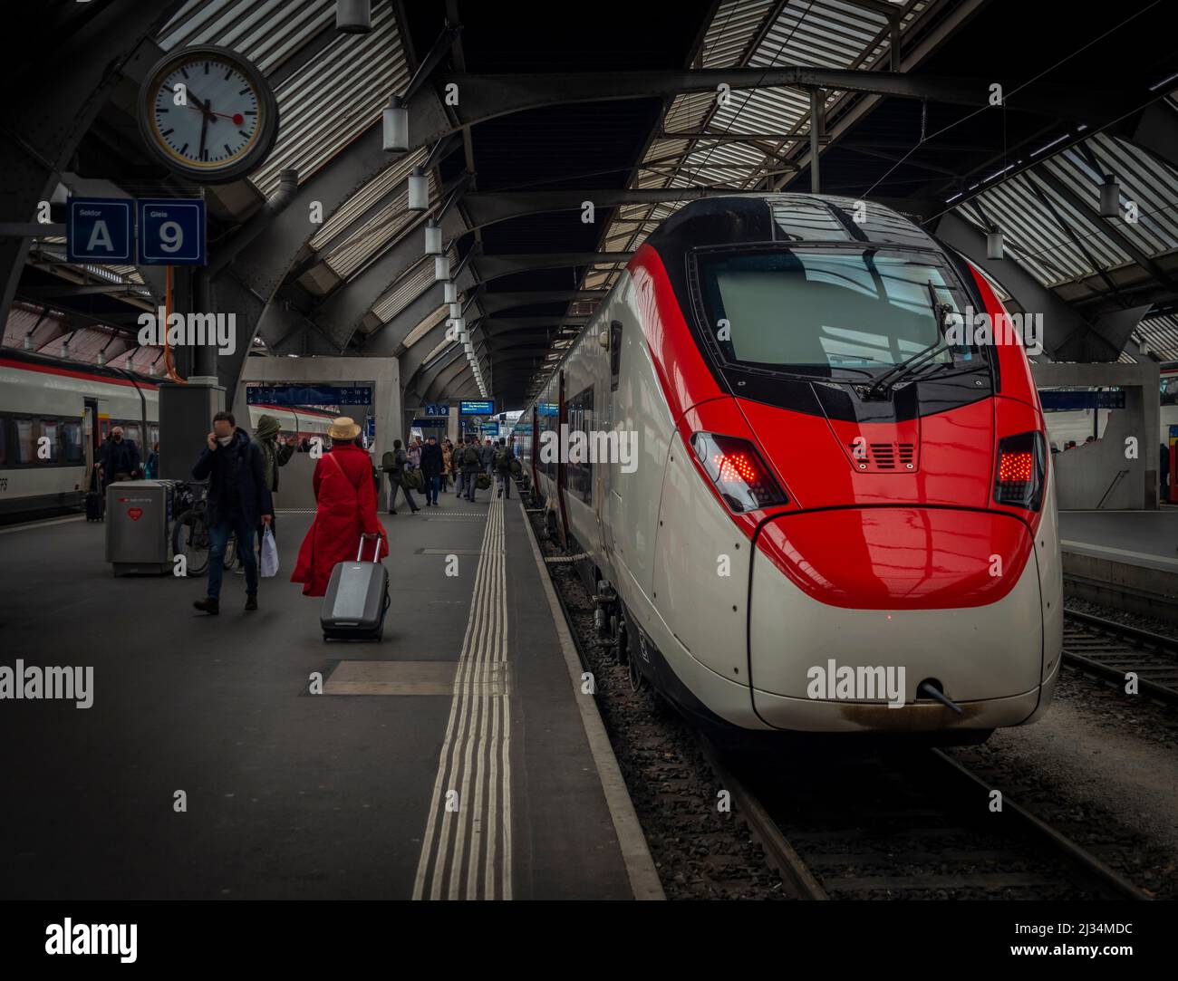 Red fast high speed train in Zurich station in south of Switzerland ...