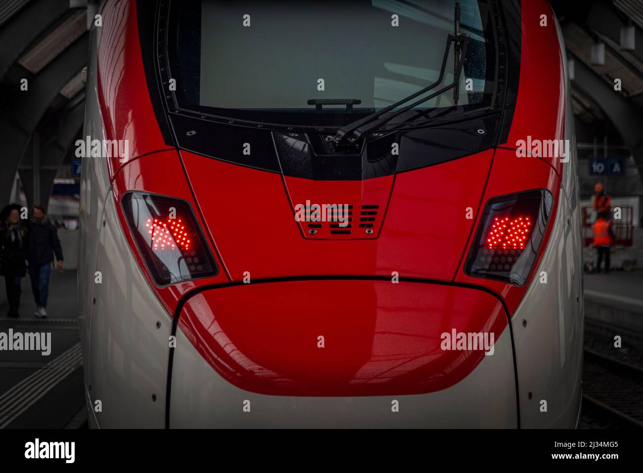 Red fast high speed train in Zurich station in south of Switzerland ...
