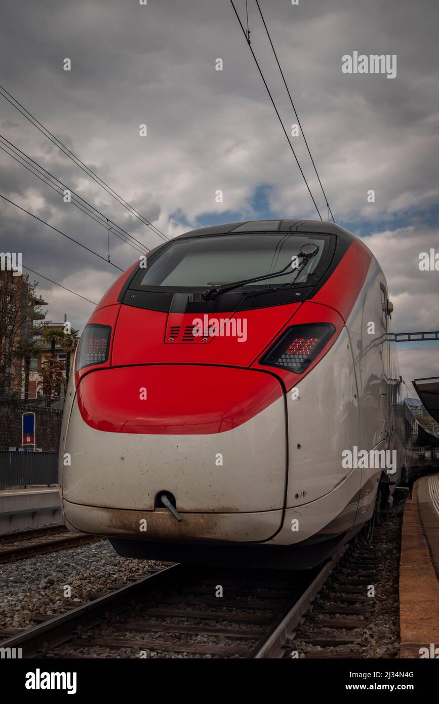 Red fast high speed train in Lugano station in south of Switzerland ...