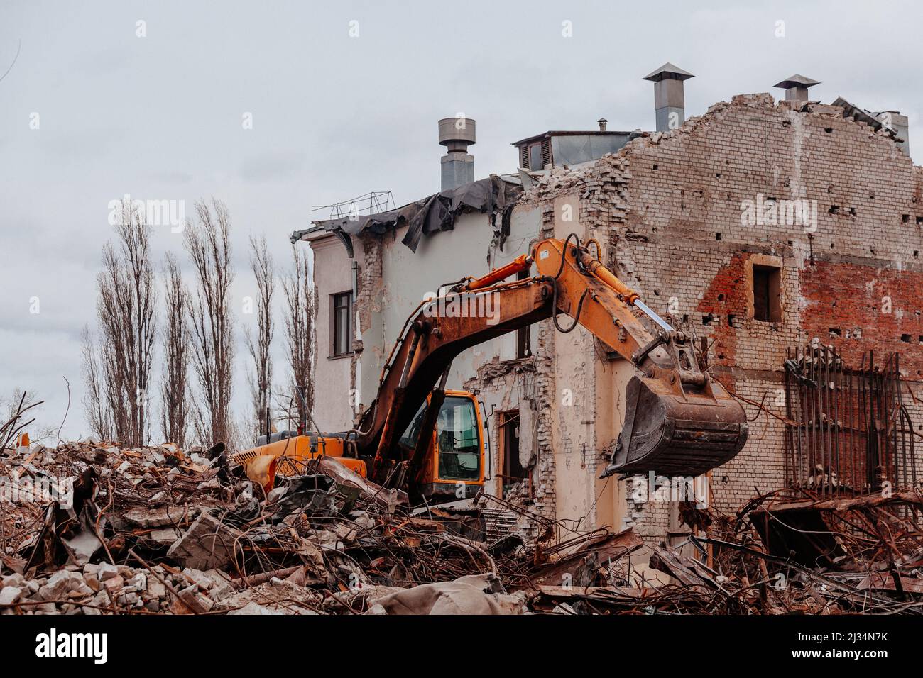 Excavator on demolition site. Process of demolition of old industrial ...