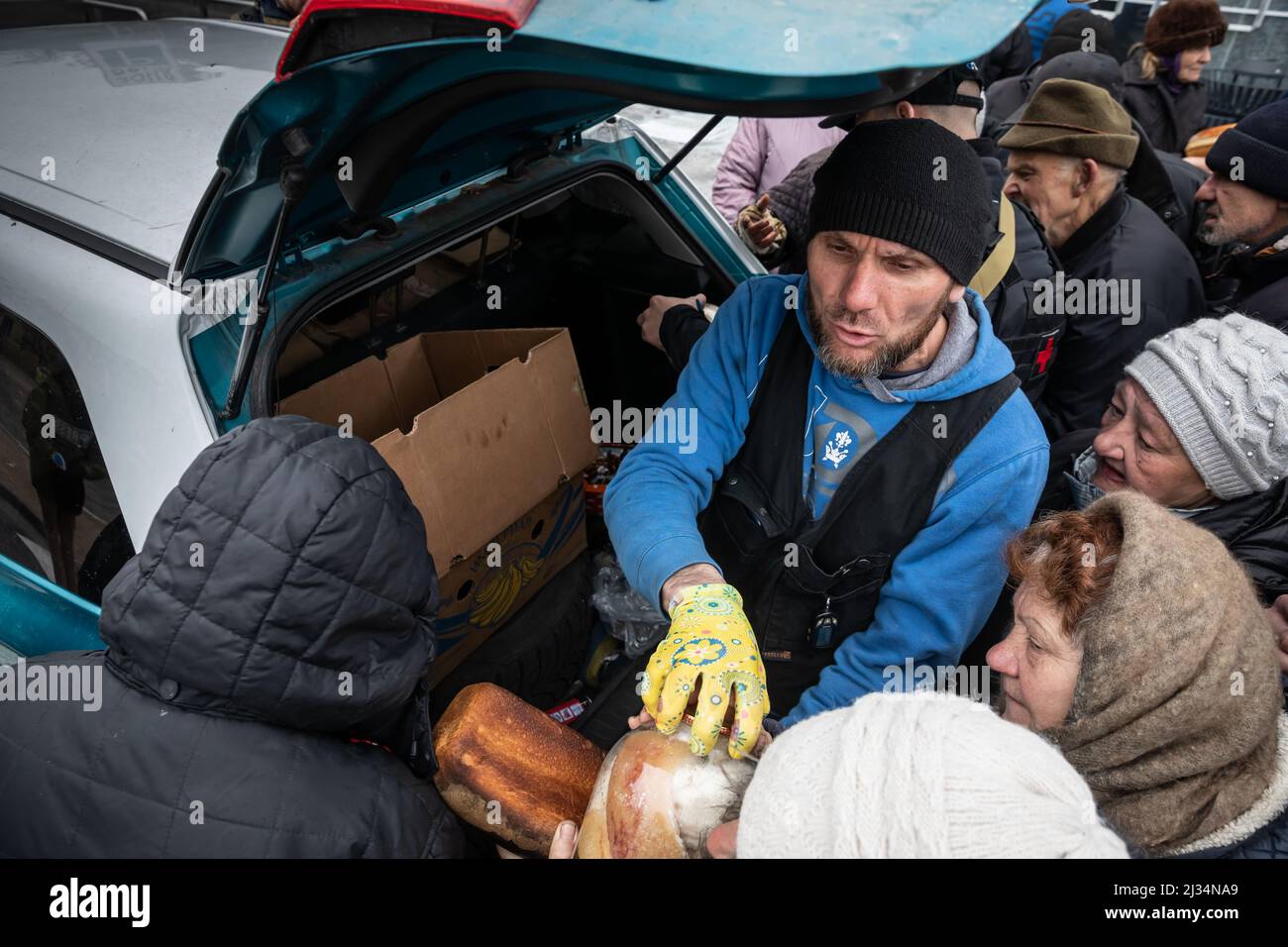 Bucha, volunteer giving people food, pictured 5.4.2022 (CTK Photo ...