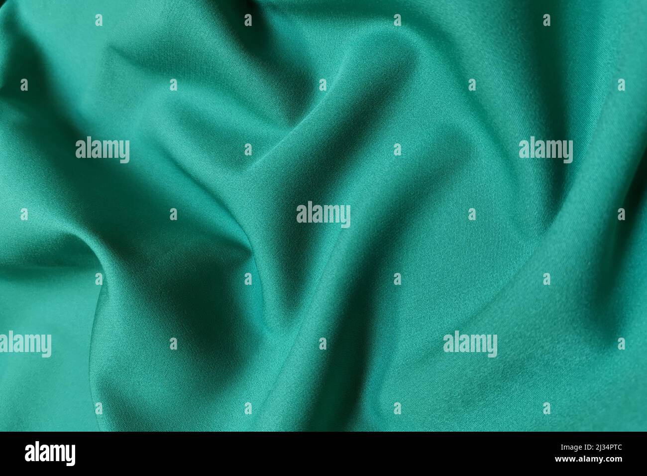 Green crumpled or wavy fabric texture background. Abstract linen cloth ...
