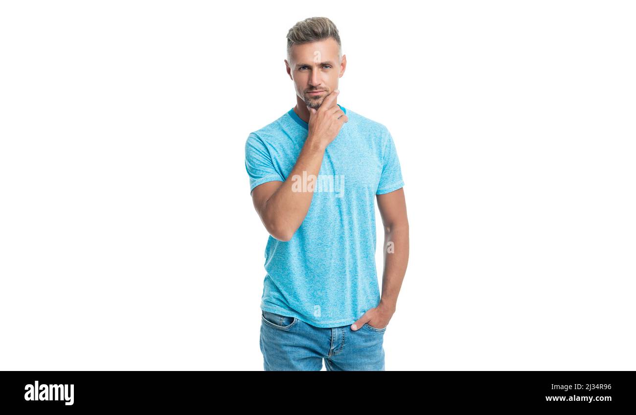Serious caucasian middleaged guy stroking chin in casual style isolated ...