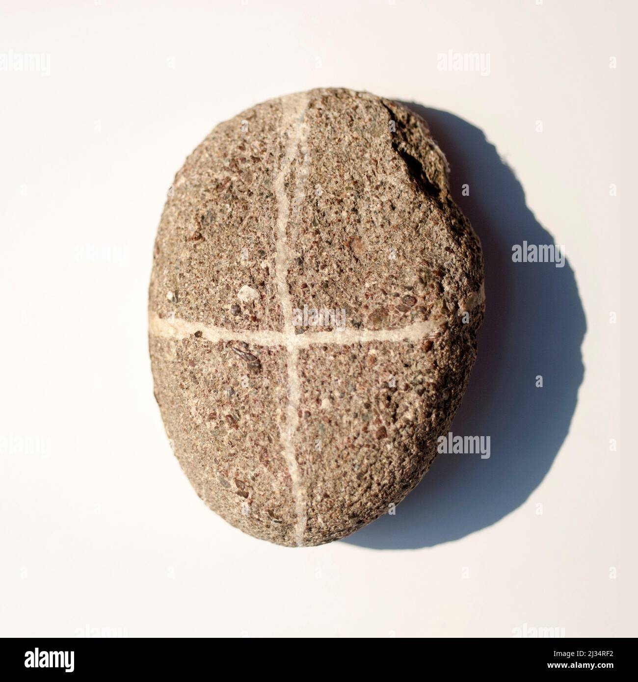 The stone with the sign plus isolated on white Stock Photo - Alamy