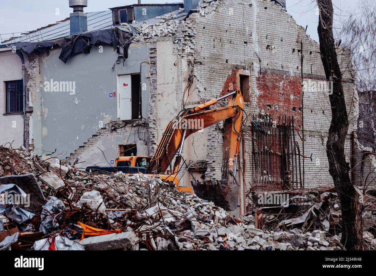 Excavator on demolition site. Process of demolition of old industrial ...