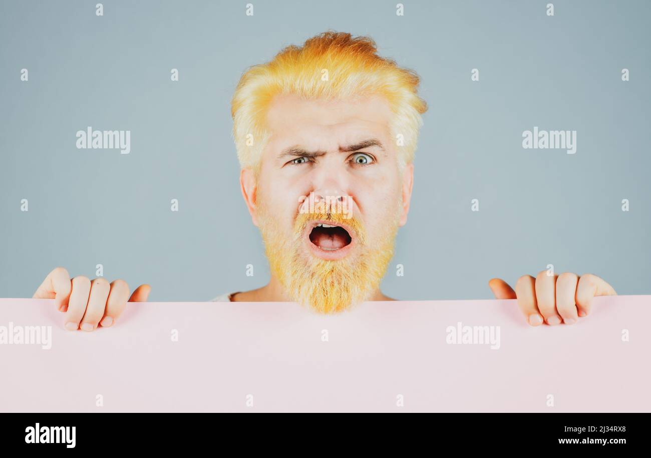 Funny man holding blank sheet. Discount. Smiling man holding empty ...