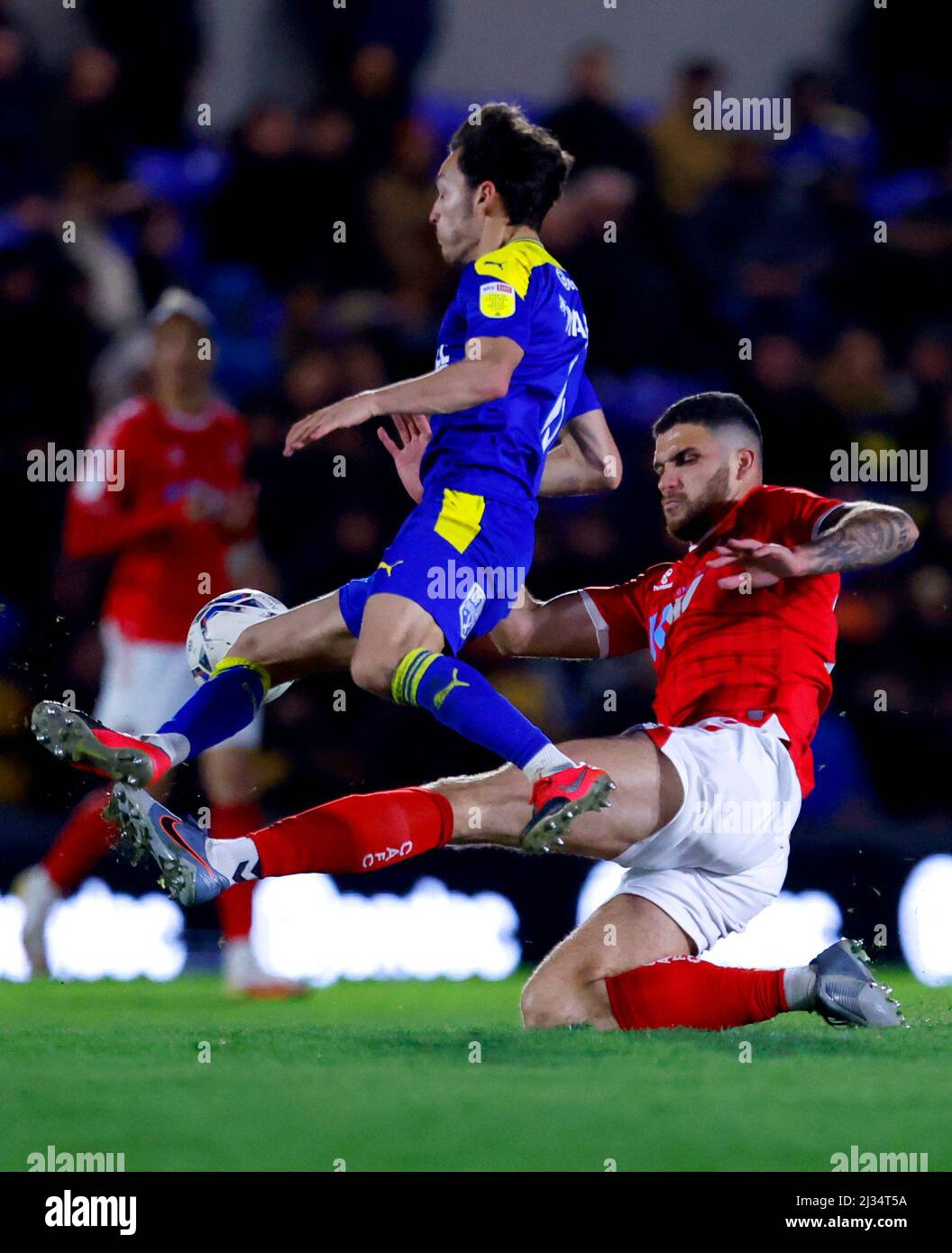 Charlton Athletic's Ryan Inniss (right) fouls AFC Wimbledon's George ...