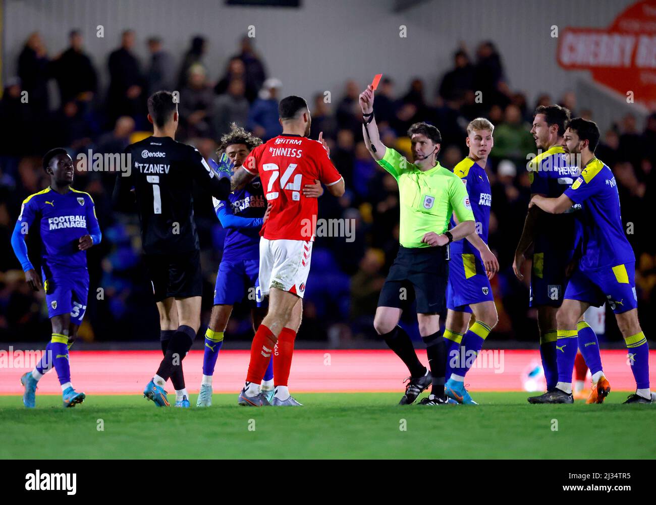 Charlton Athletic's Ryan Inniss is shown a red card after fouling AFC ...