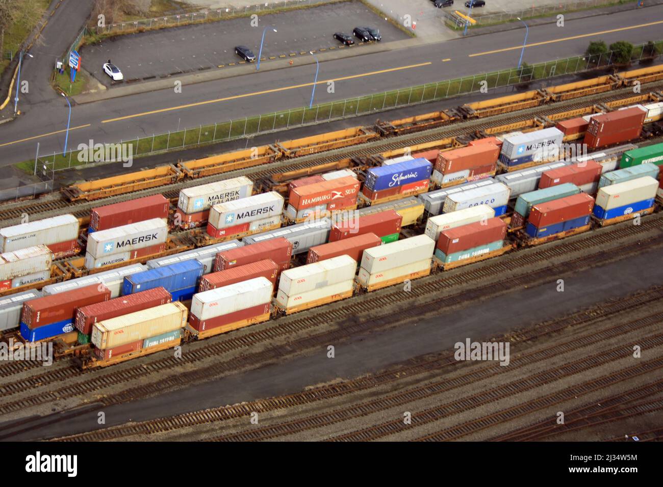The trains with shipping containers are in downtown Vancouver, British ...