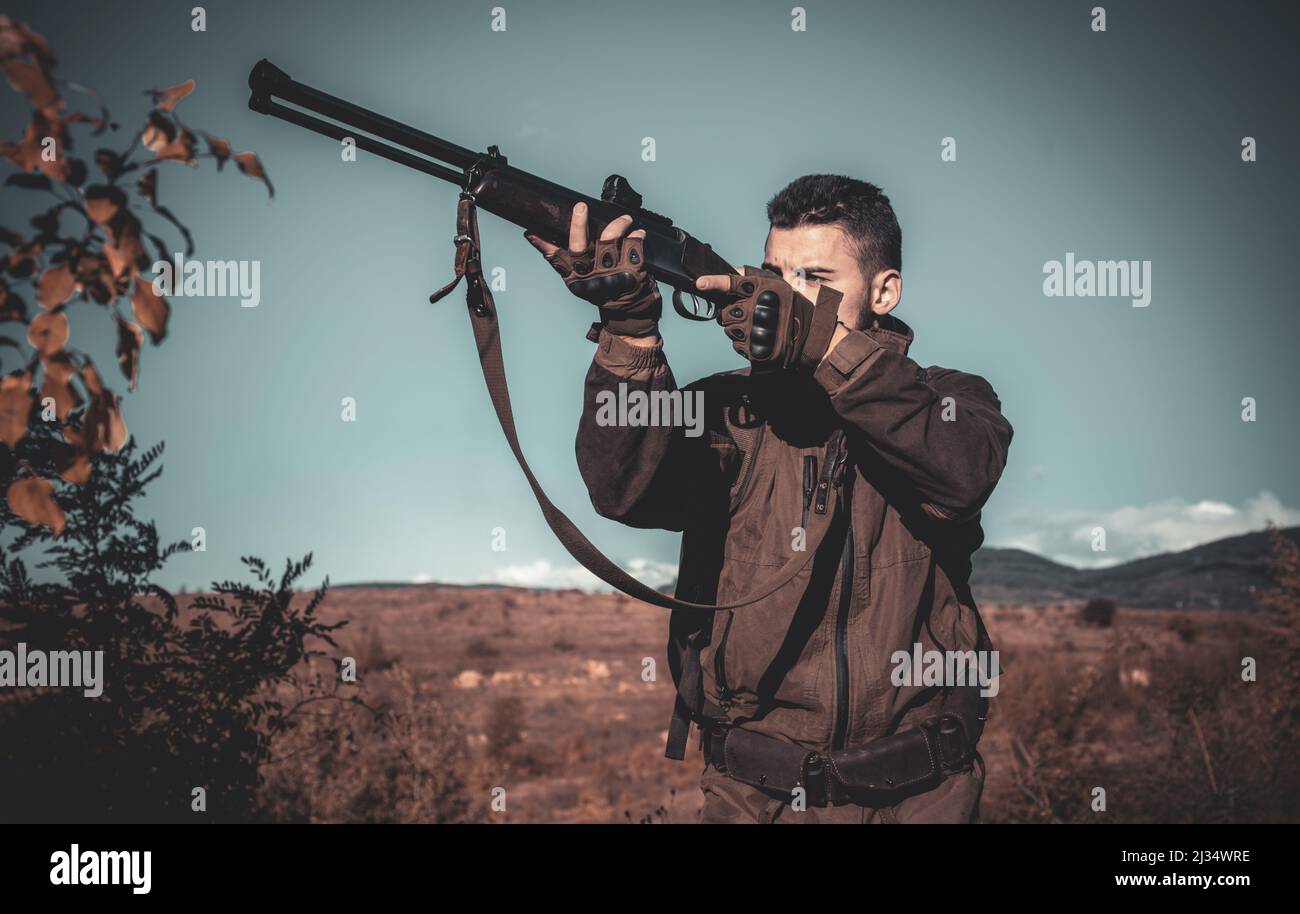 Hunter with shotgun gun on hunt. Calibers of hunting rifles. Hunter ...
