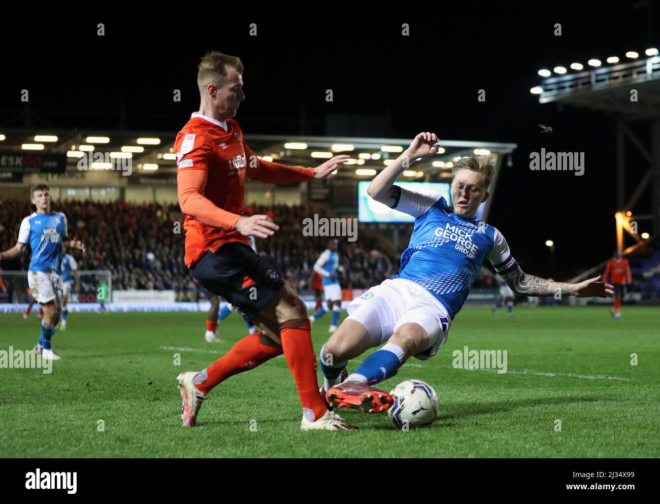 Peterborough United's Frankie Kent challenges Luton Town's James Bree ...