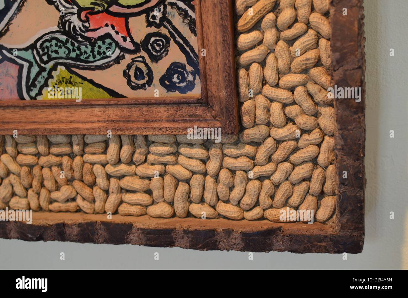 Painting frame made of peanuts Stock Photo - Alamy