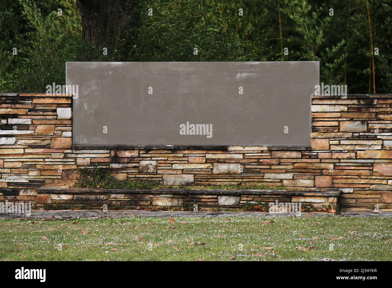 a cemetery grave marking tombstone empty carved stone graveyard wall ...