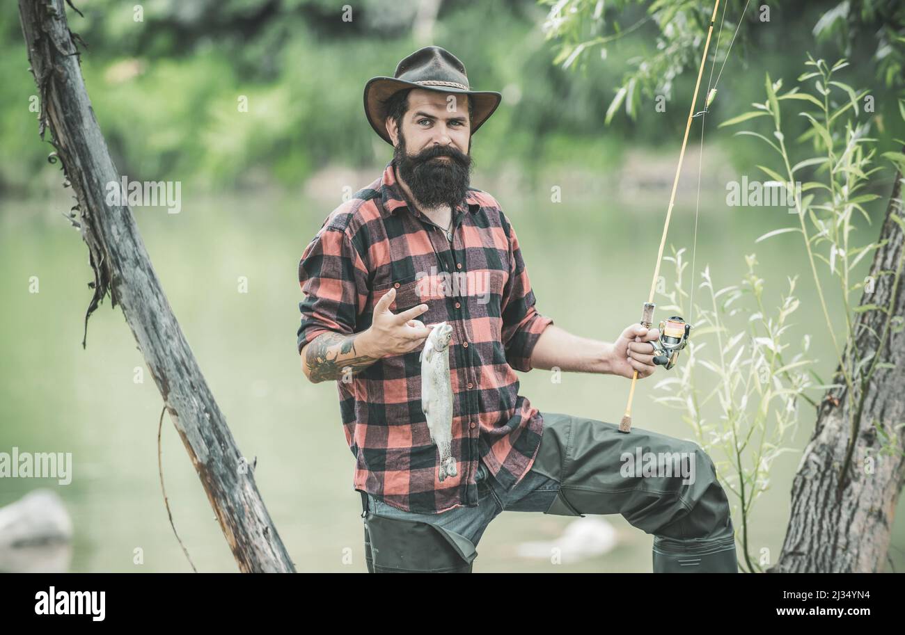Man fishing and relaxing while enjoying hobby. Men fishing in river ...