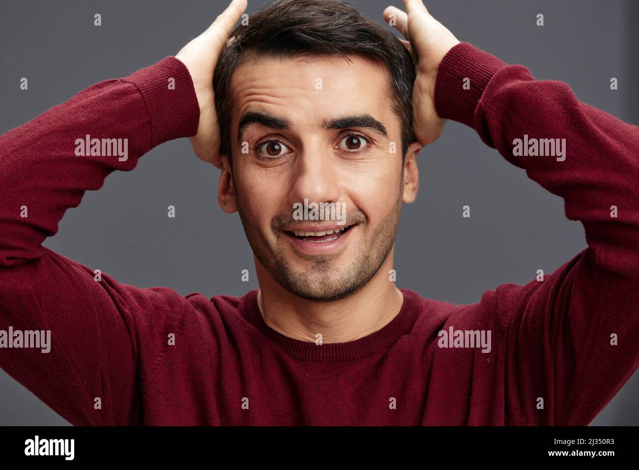 successful man in a red sweater hand gesture posing self confidence ...