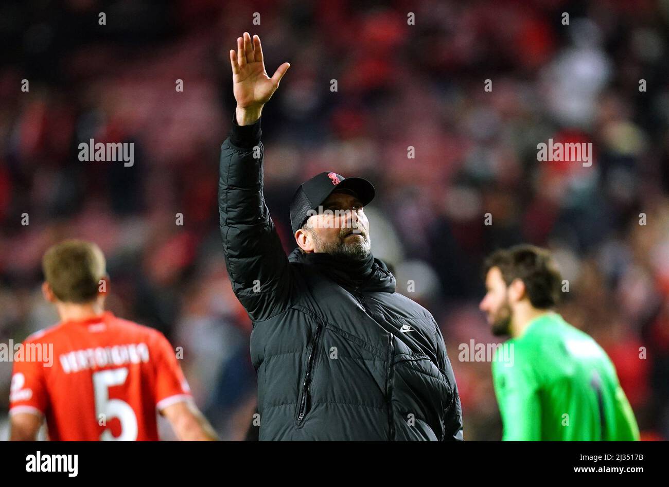 Liverpool manager Jurgen Klopp (centre) salutes the fans following the ...