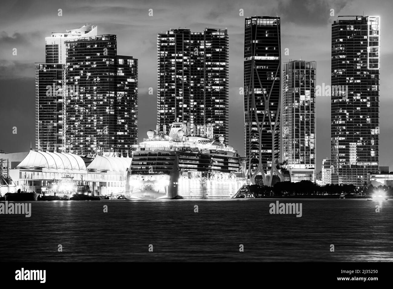 Miami night downtown. Cruise ship in the Port of Miami at sunset with ...