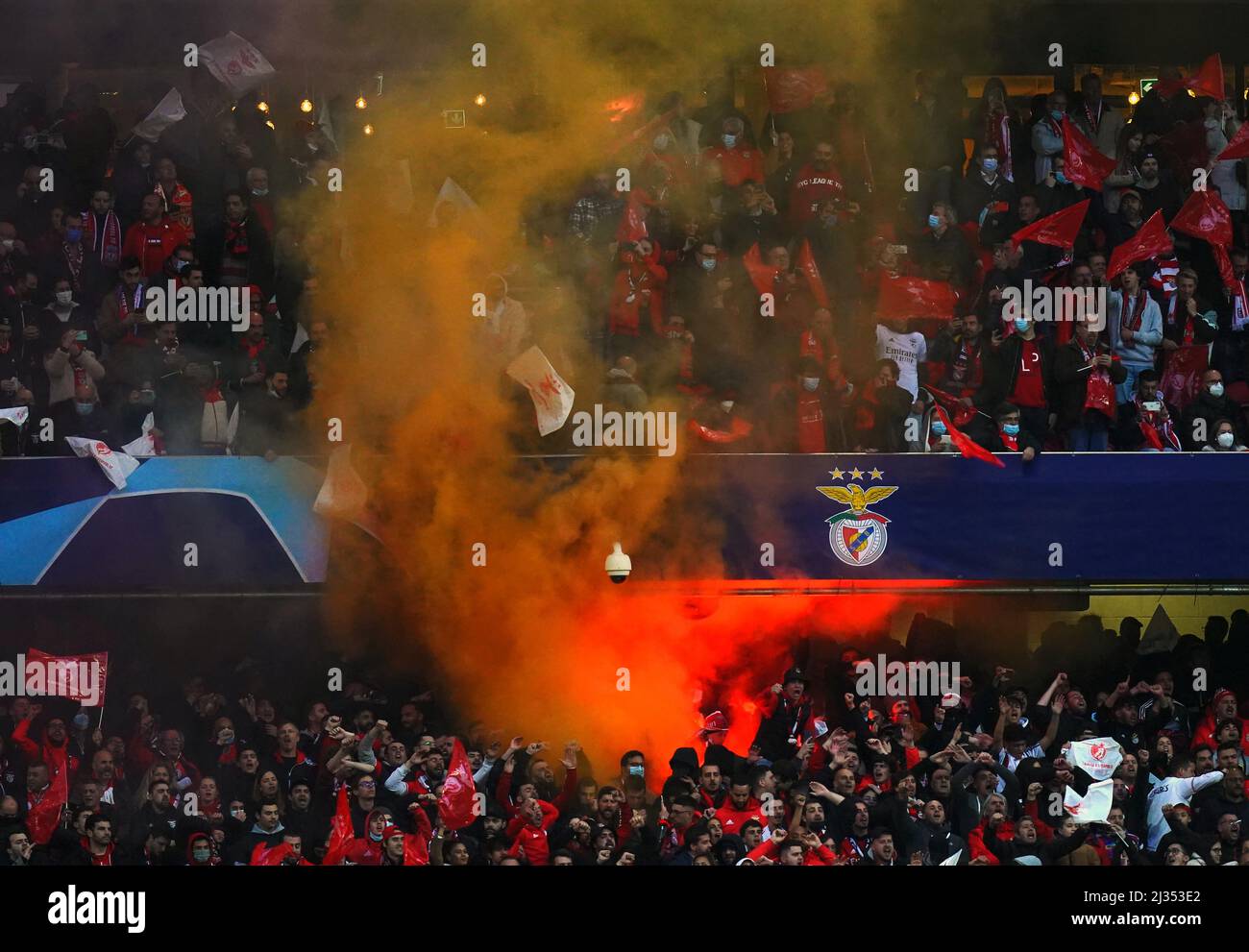 Benfica fans in the stands set off a red flare during the UEFA ...