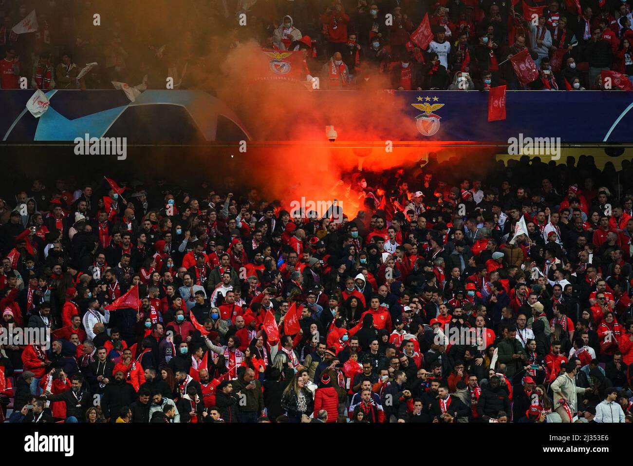 Benfica fans in the stands set off a red flare during the UEFA ...