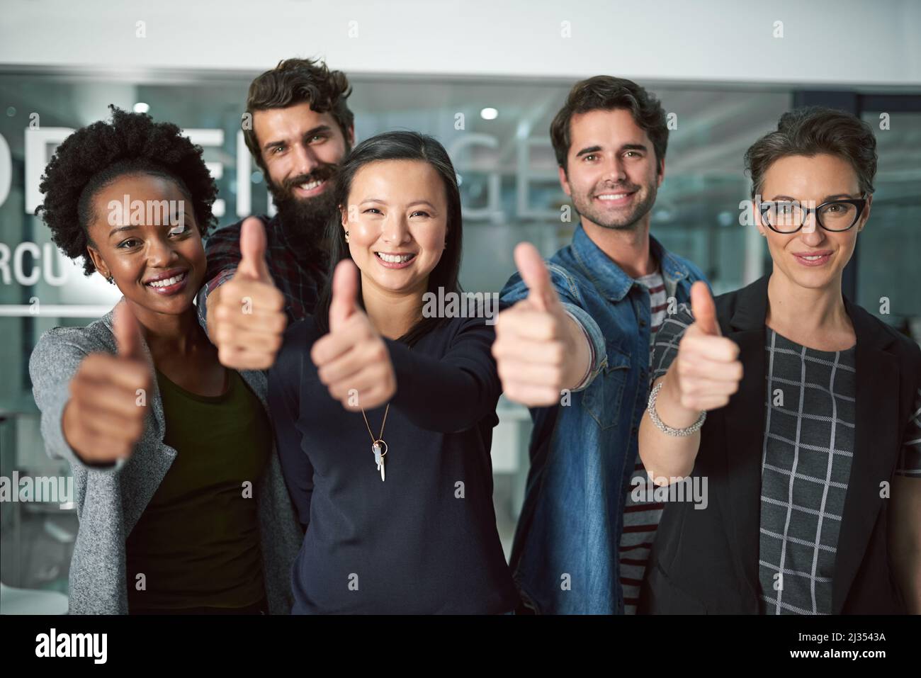 We did it together. Cropped shot of a group of creative businesspeople ...