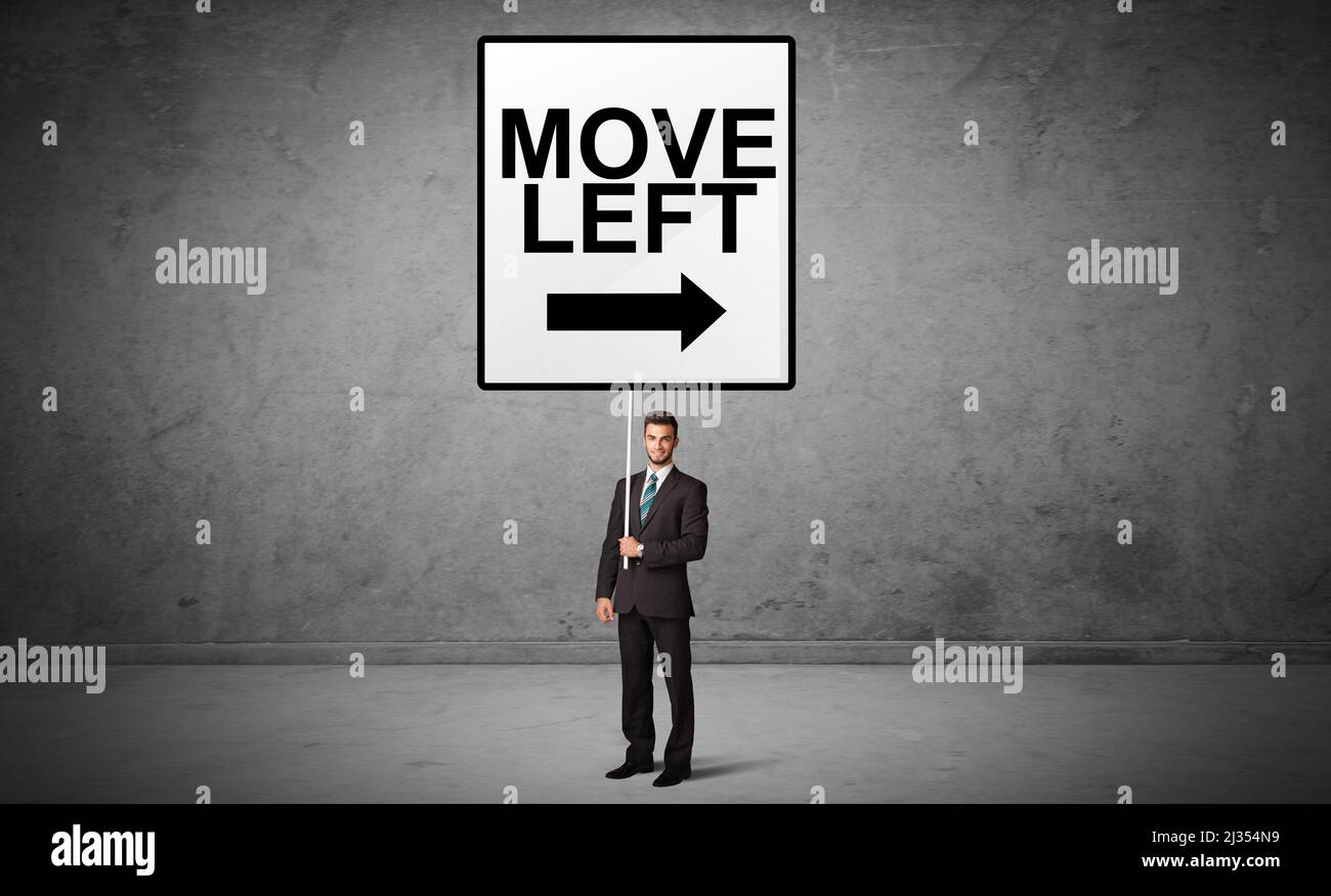 business person holding a traffic sign Stock Photo - Alamy