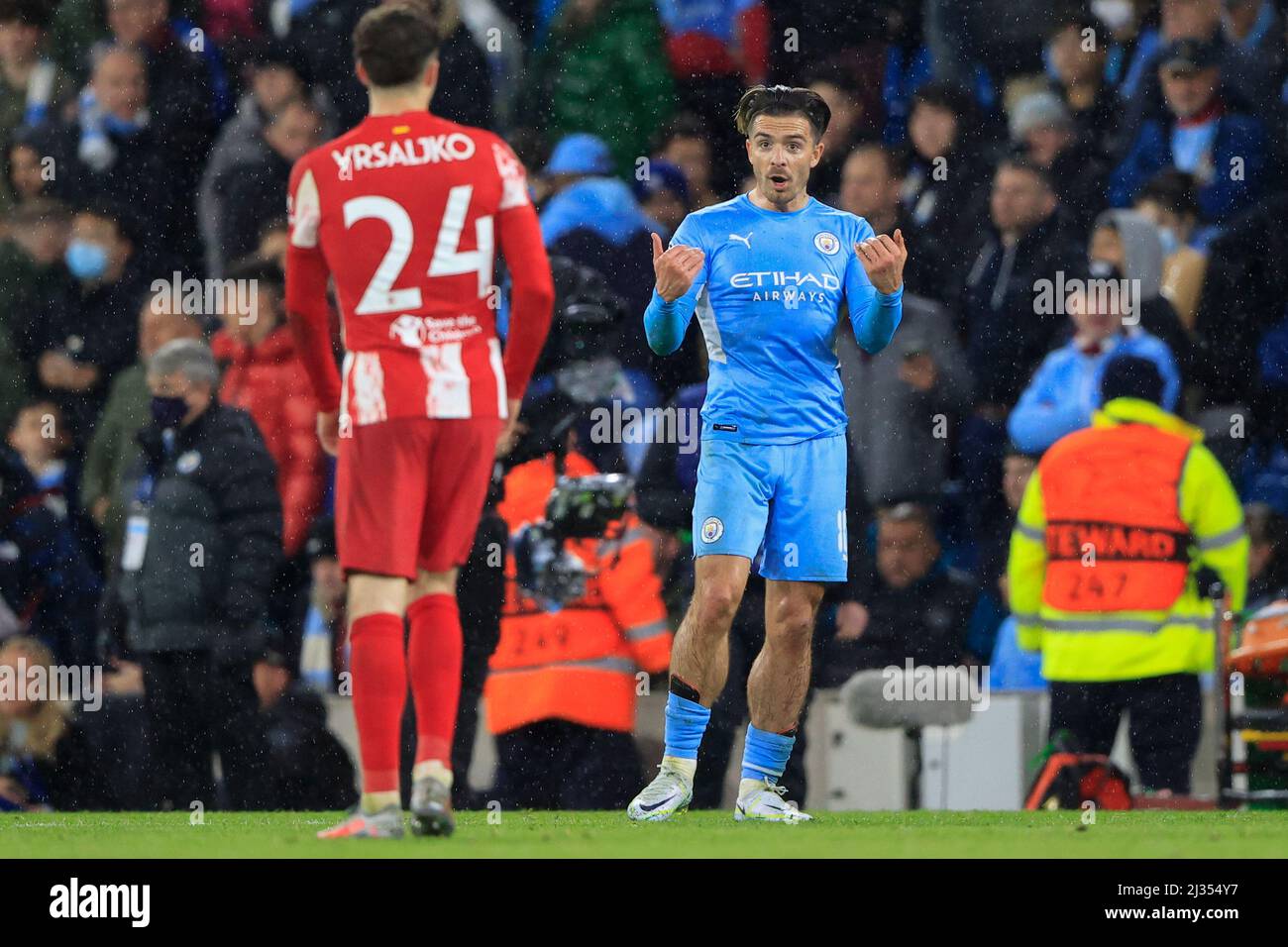 Jack Grealish #10 of Manchester City carries on his conversation with ...
