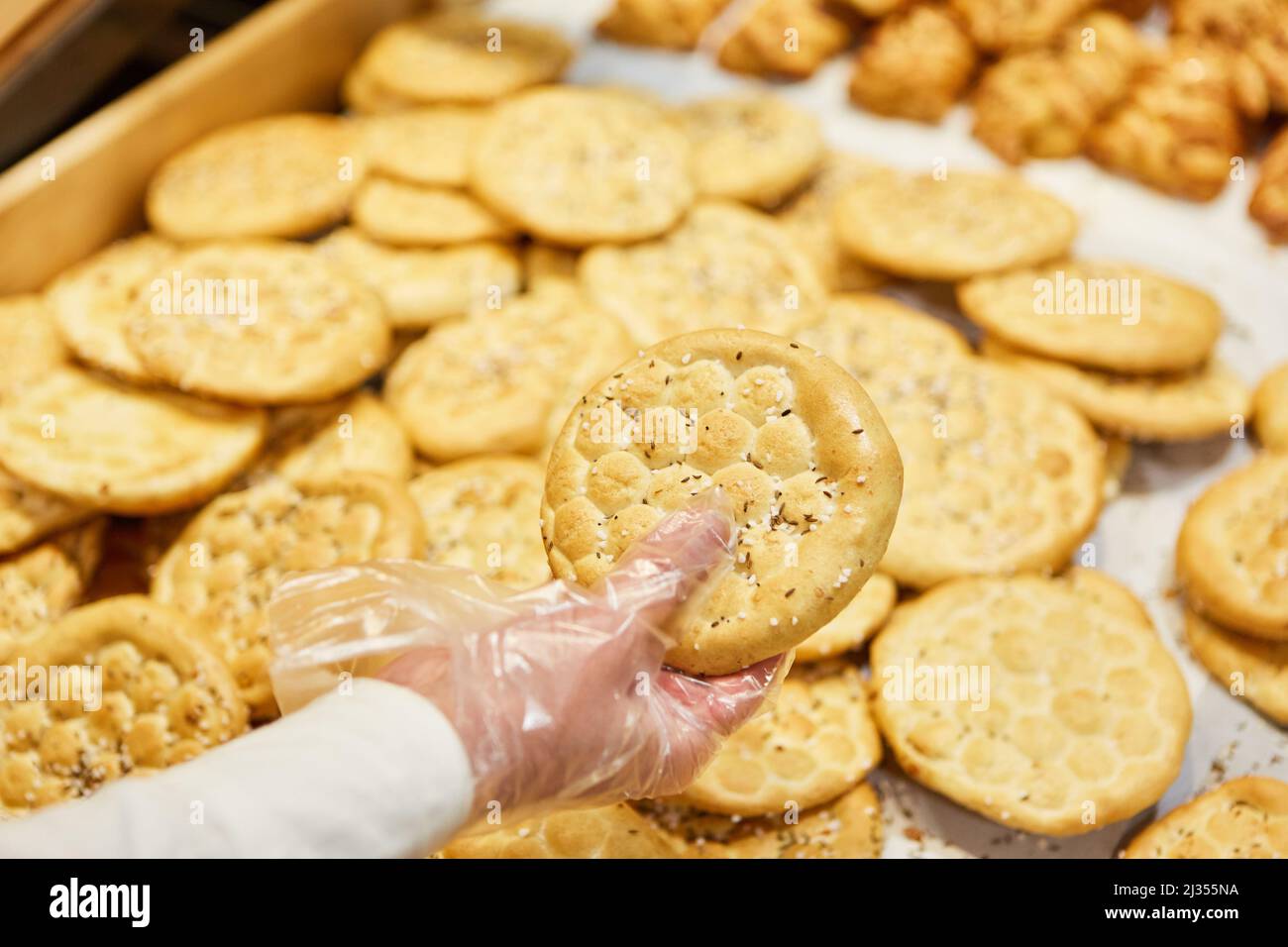 Customer packs flatbread in a plastic bag when shopping in the ...