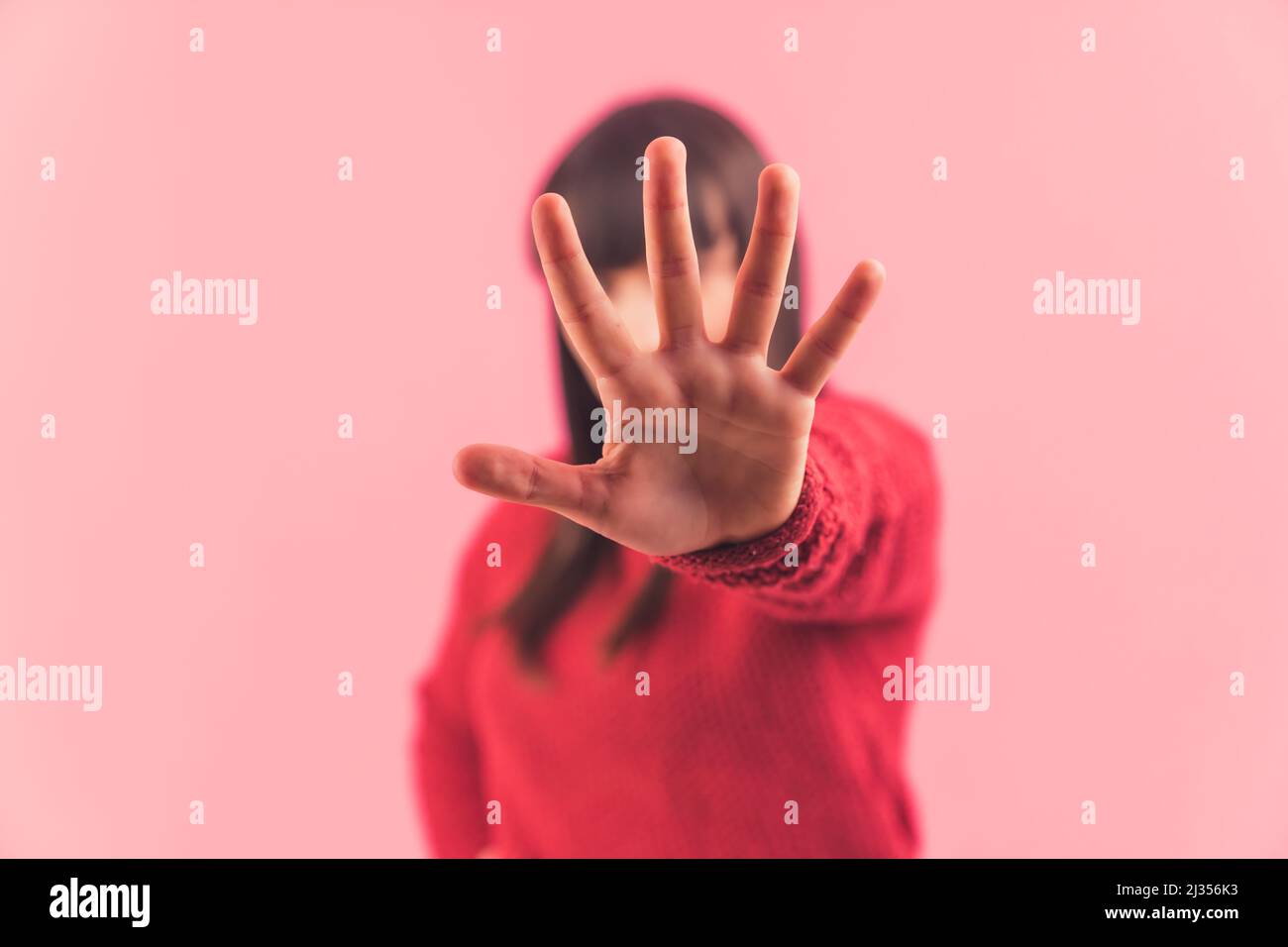 Stop sign, palm, hand on camera, symbol. Focus on the foreground ...