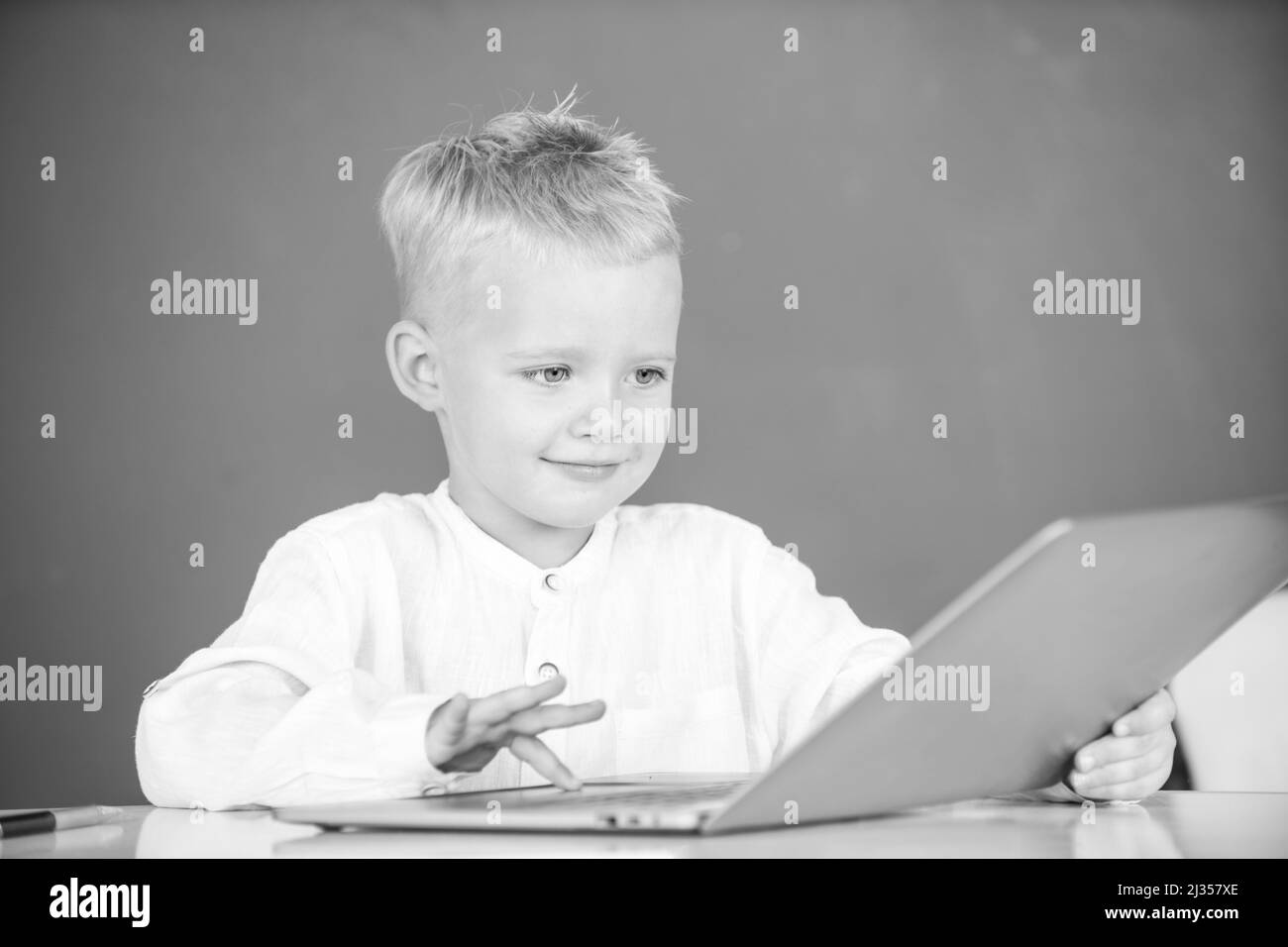 School boy studying math during online lesson in classroom, online ...