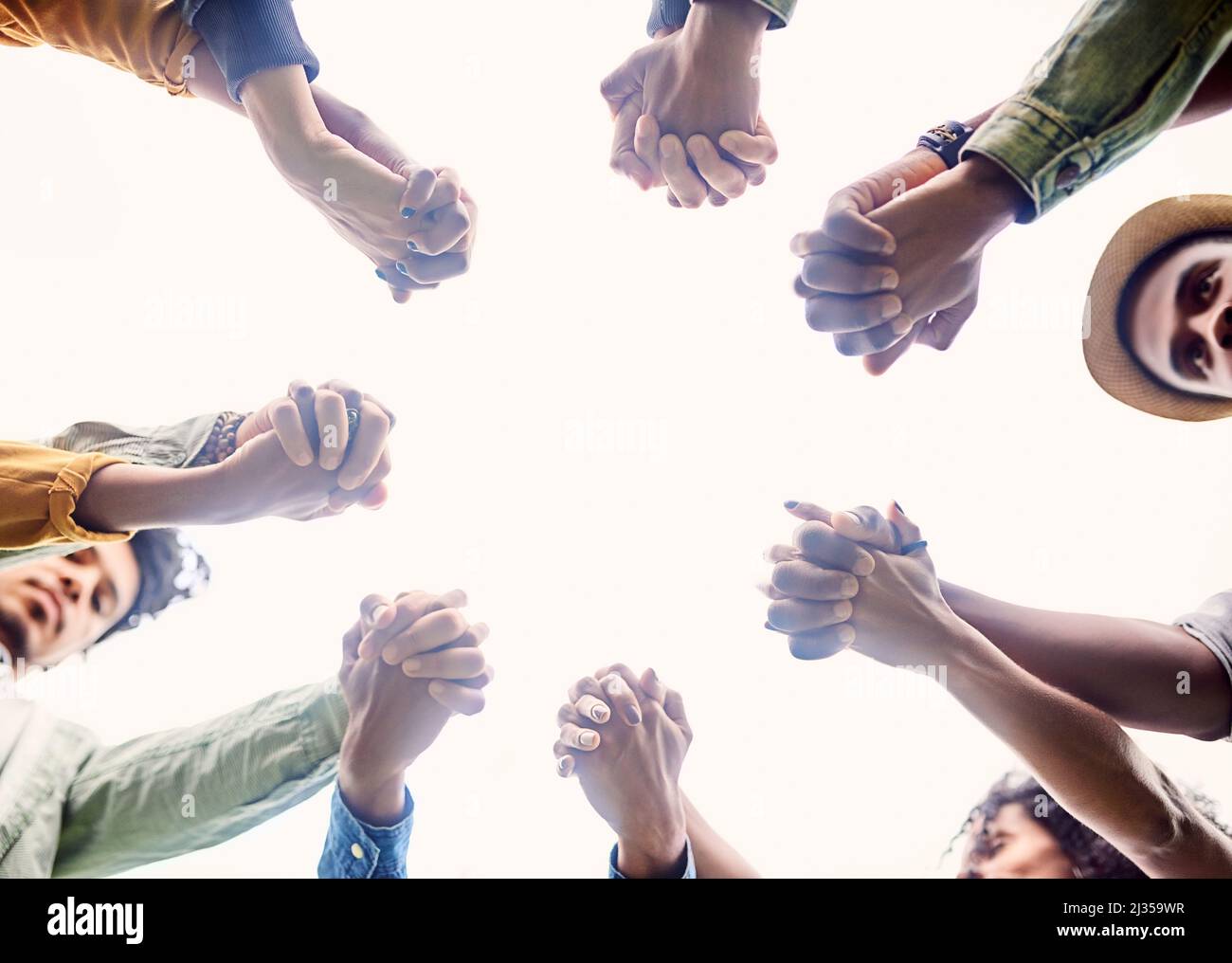 Group of people holding hands park hi-res stock photography and images ...