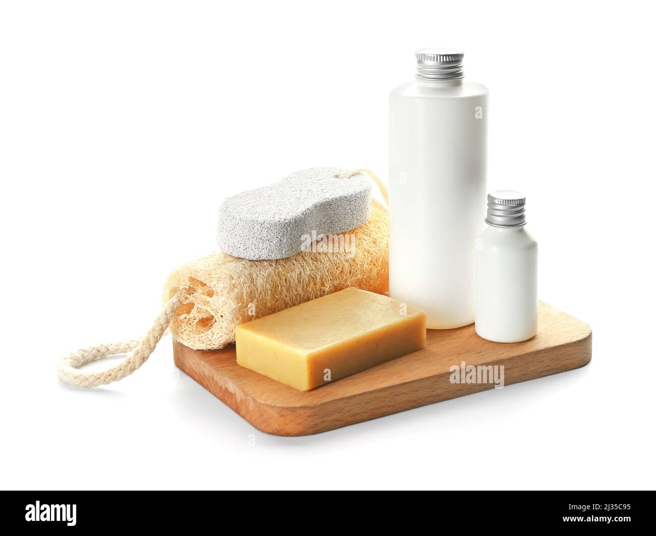 Wooden board with bottles of cosmetic products, soap, bath sponge and ...