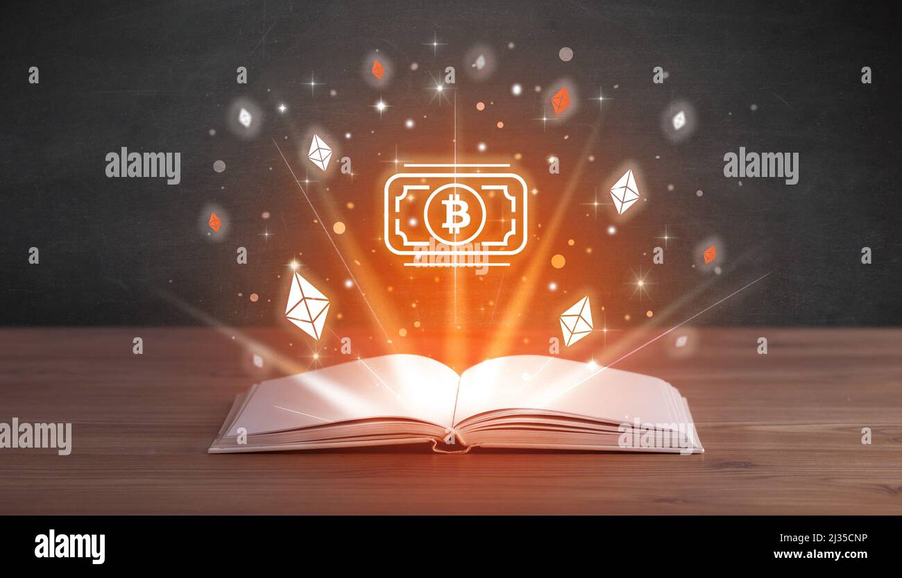 Open book with currency icons above Stock Photo - Alamy