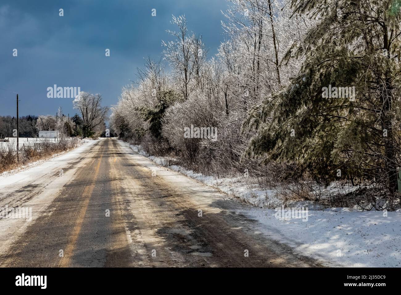 Country road after a dangerous ice storm in Michigan, USA Stock Photo ...