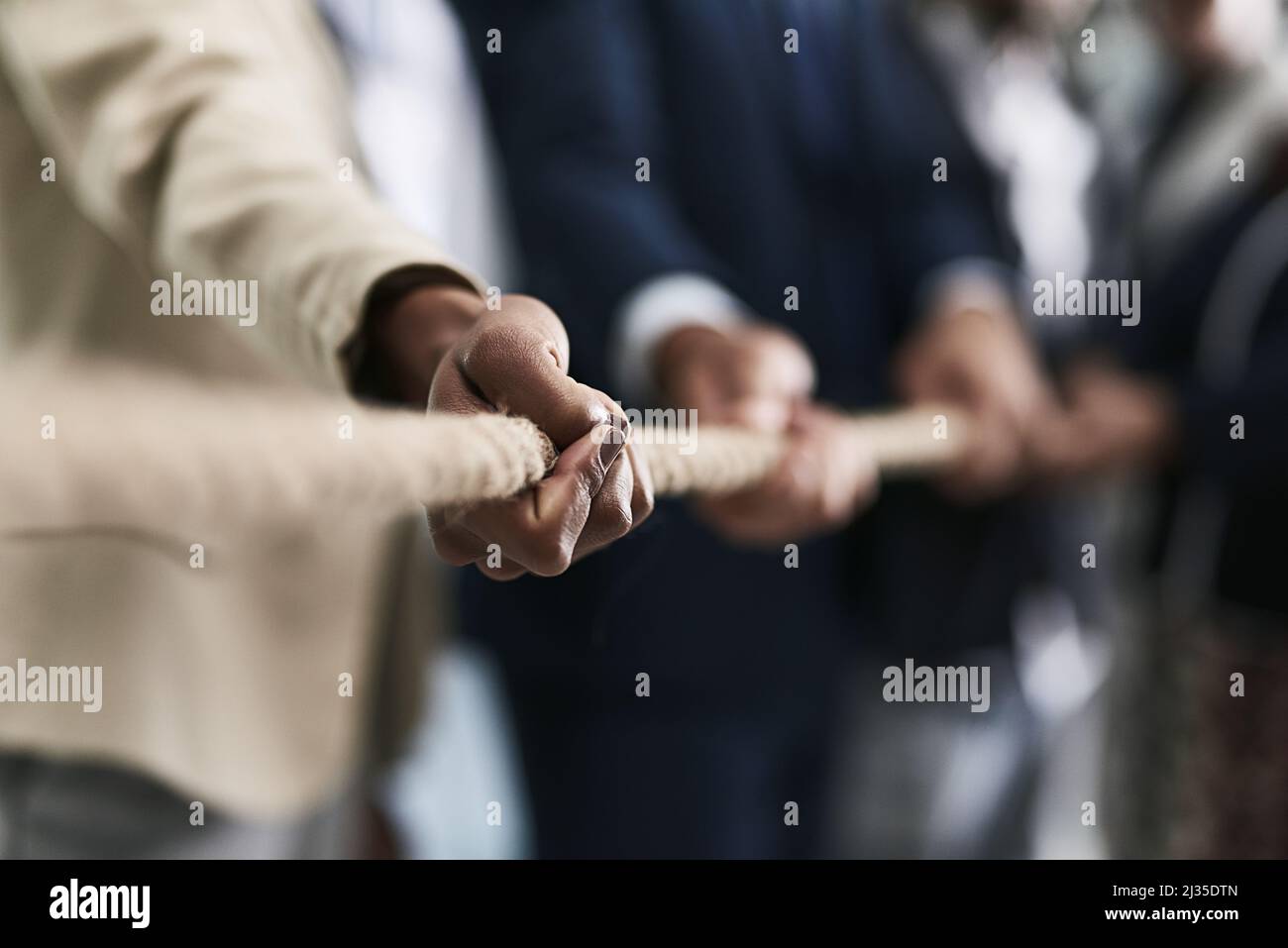 Working together to rope in success. Closeup shot of a group of ...