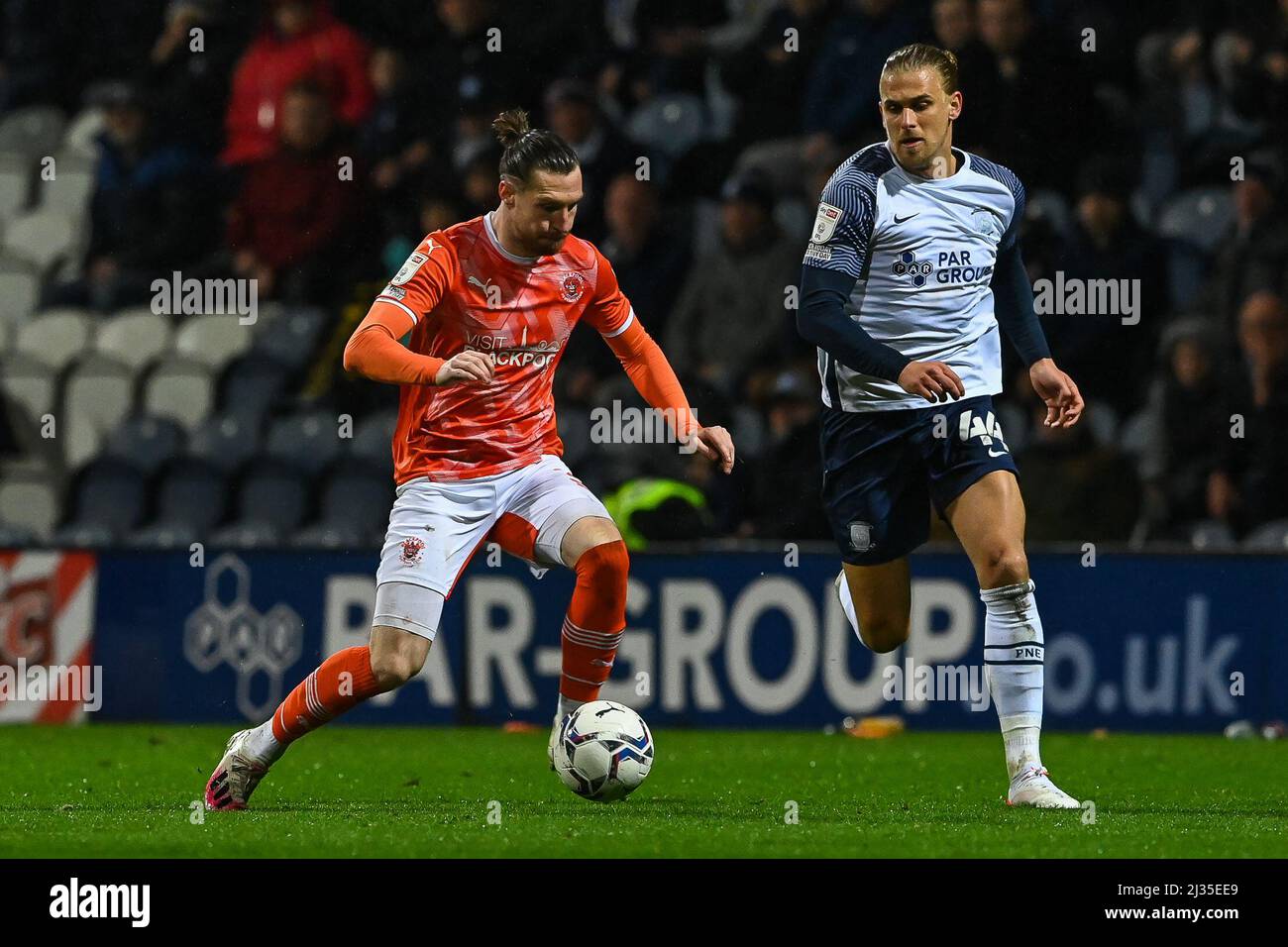 James Husband #3 of Blackpool makes a break with the ball Stock Photo ...