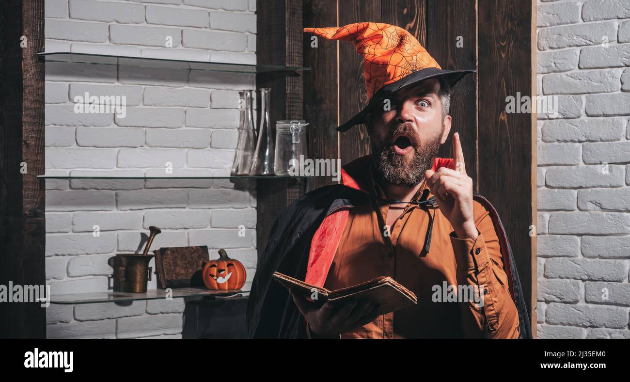 Scary face man with horror Make up holding Pumpkin head jack lantern on ...