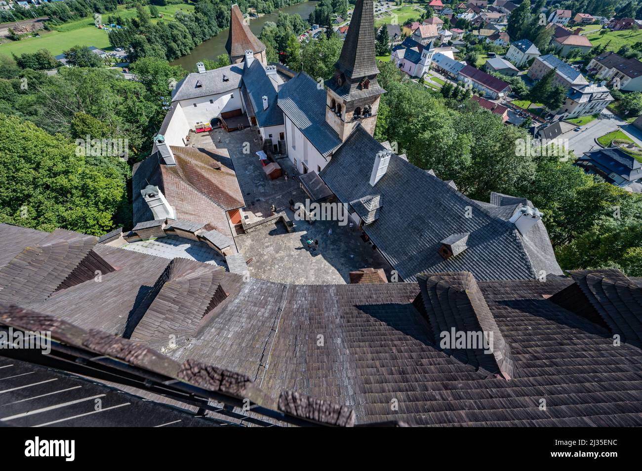 A top view from the roof of Orava Castle with trees and houses in the ...