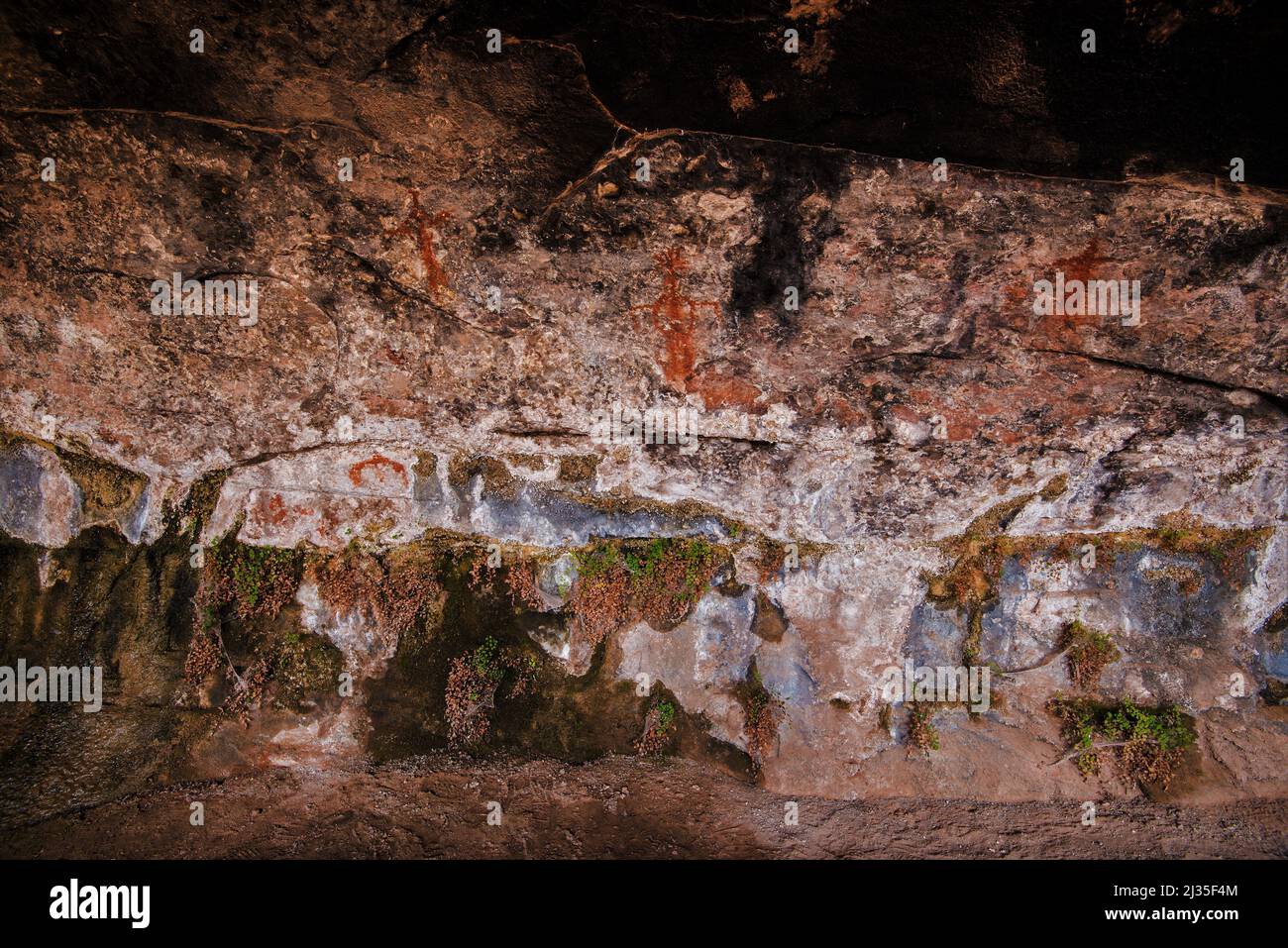 Ancient pictographs on a cave wall in Canyonlands National Park. This ...