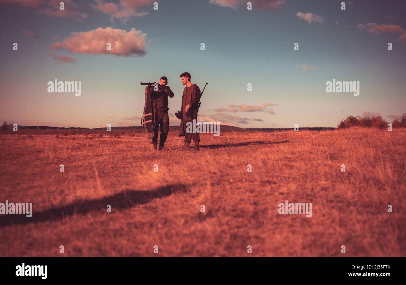 Hunting without borders. HunterS with shotgun gun on hunt. Autumn Stock ...