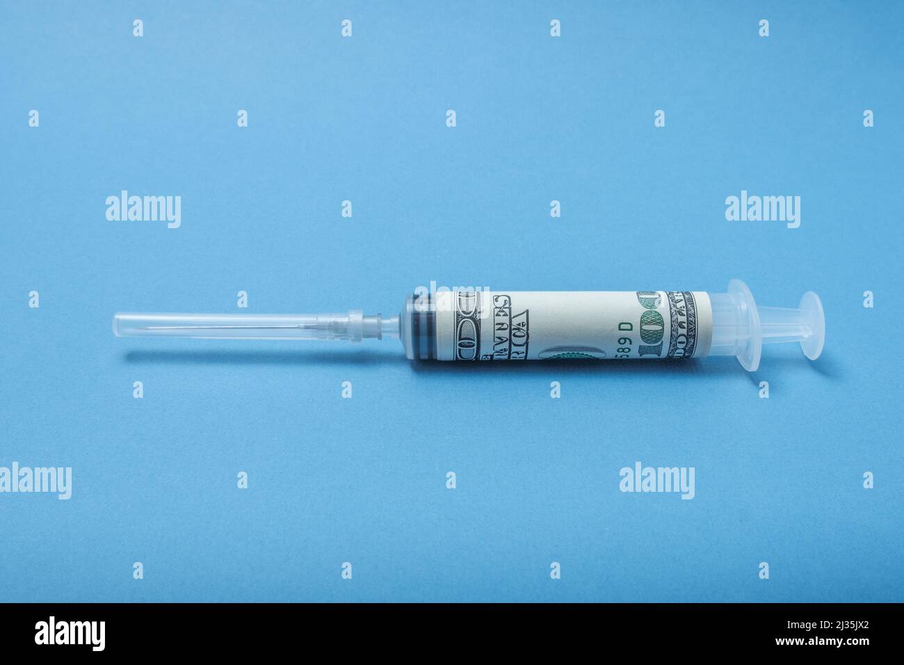 A syringe wrapped in a dollar. Financial injection into the economy ...