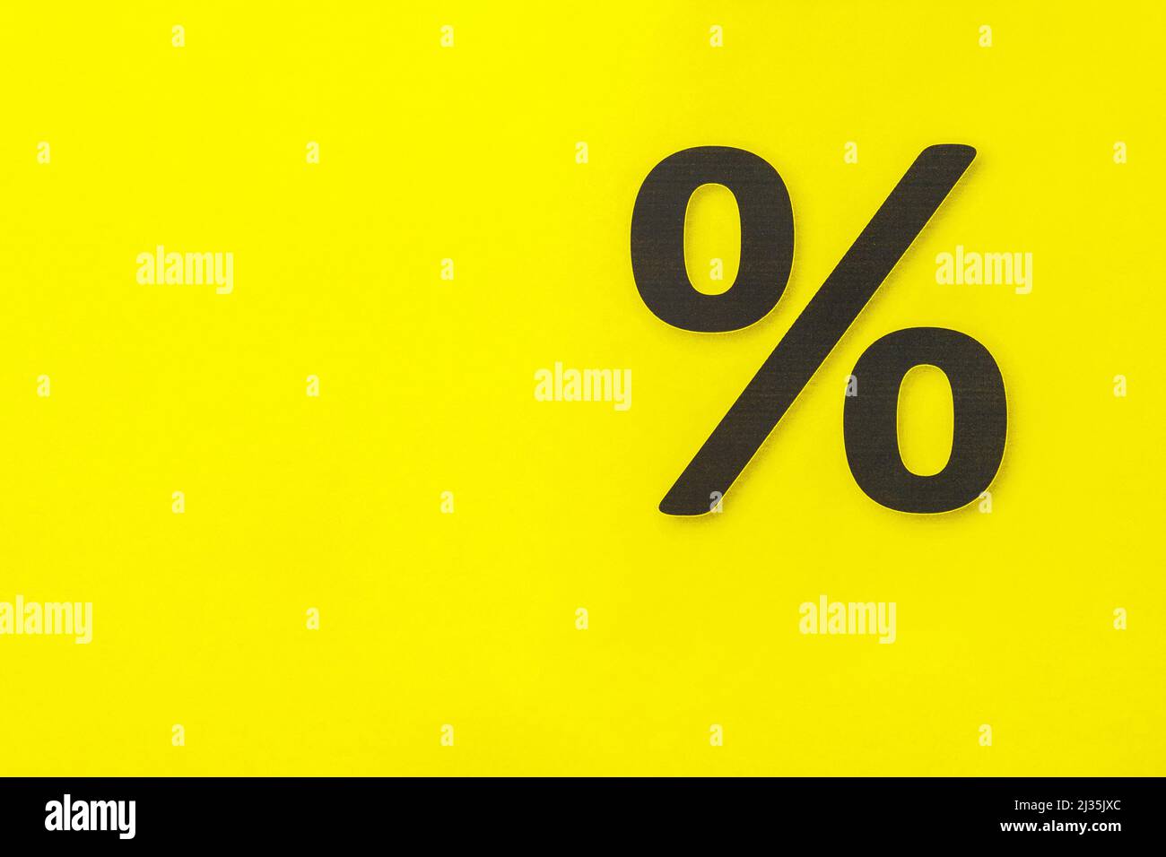 Yellow sticker with the percent symbol Stock Photo - Alamy