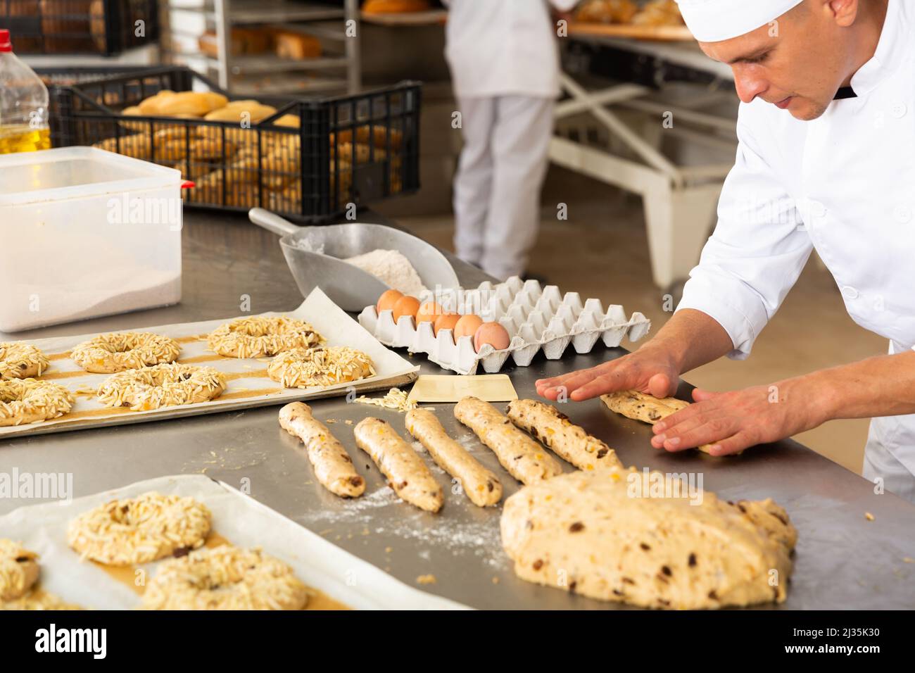 portrait male baker making cookies in bakehouse Stock Photo - Alamy