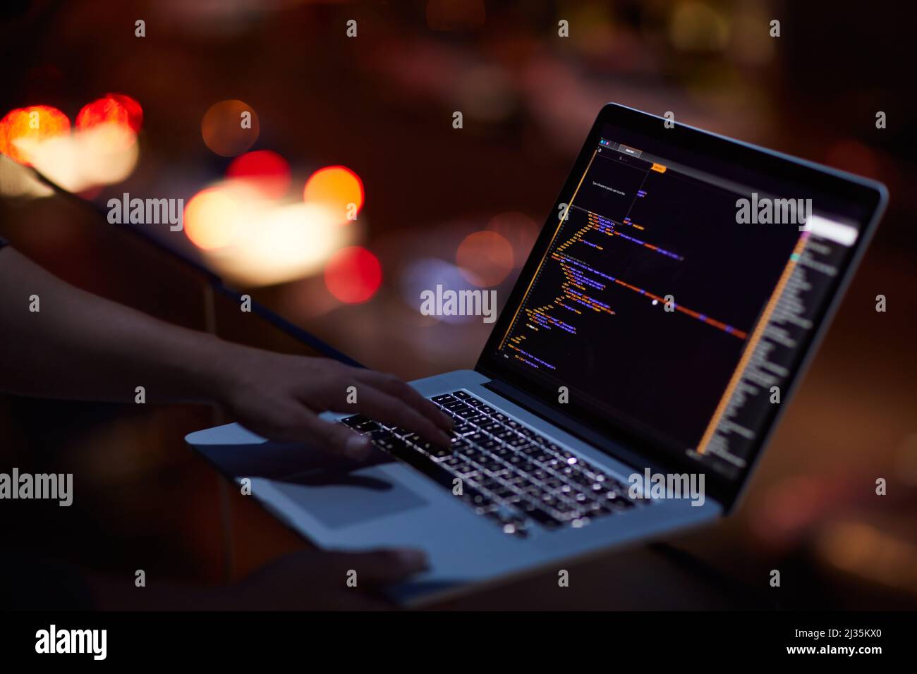 He Knows His Way Around Any Network Shot Of An Unrecognisable Hacker Using A Laptop In The Dark