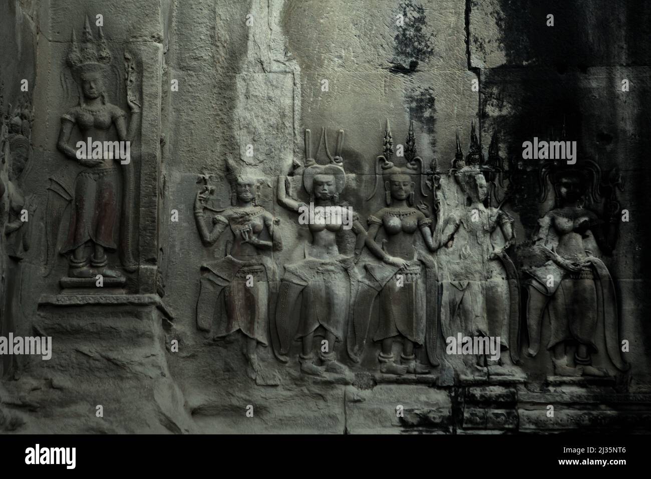 Weathered reliefs of apsara (semi-divine celestial figure, daughter of ...