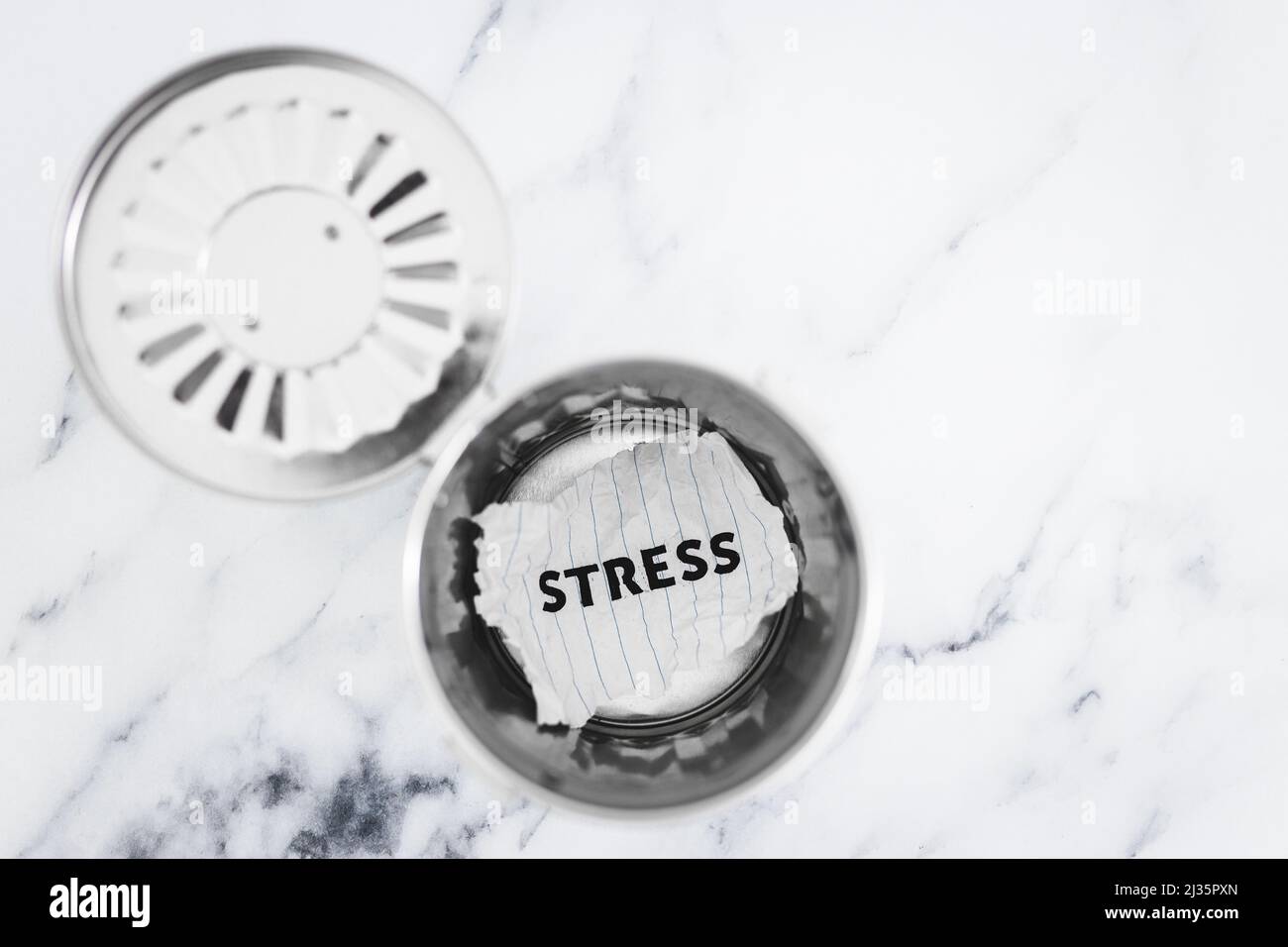 Stress text on torn page thrown inside trash bin, concept of overcoming ...