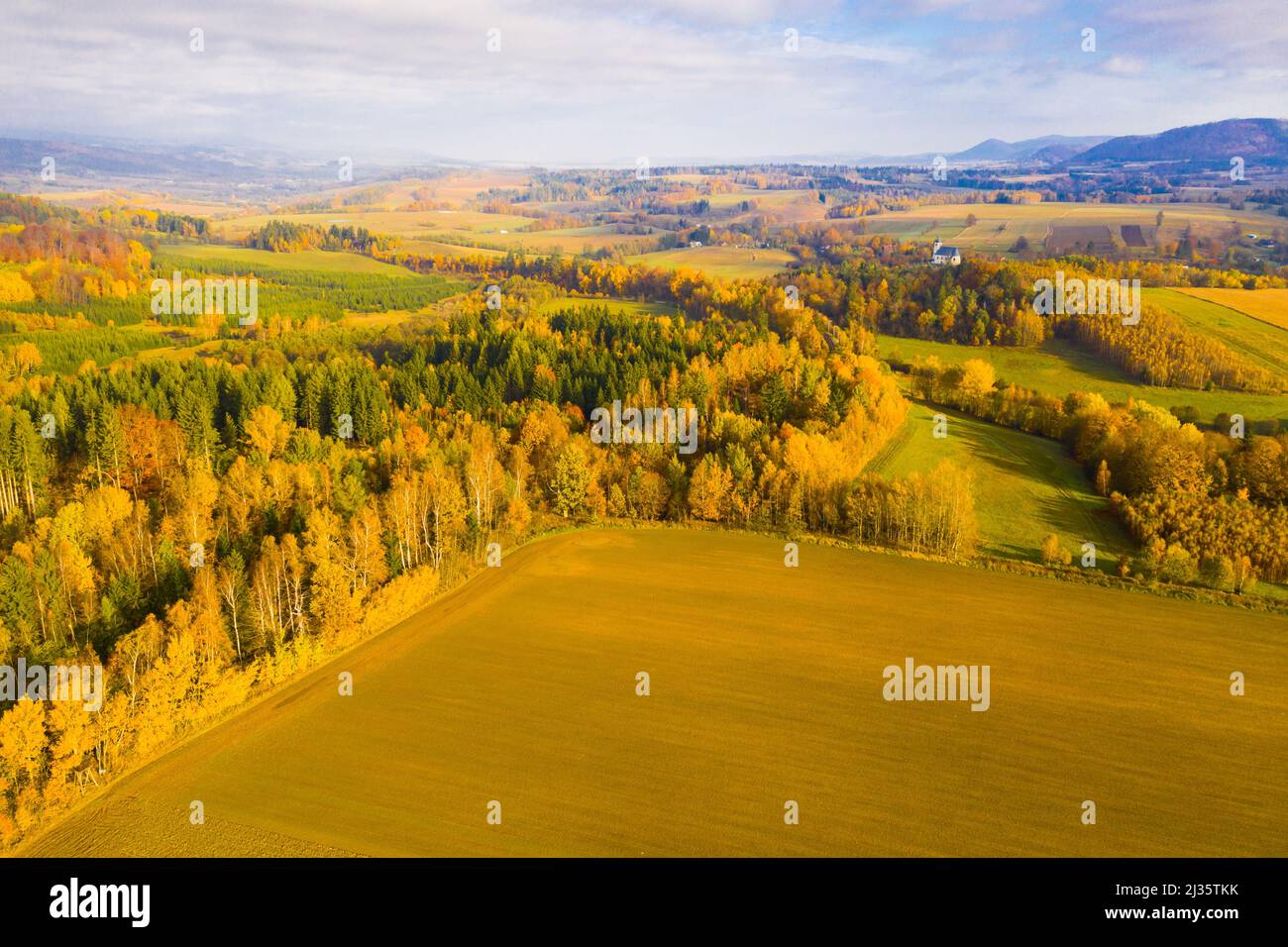 Picturesque autumn view with church on a hill Stock Photo - Alamy