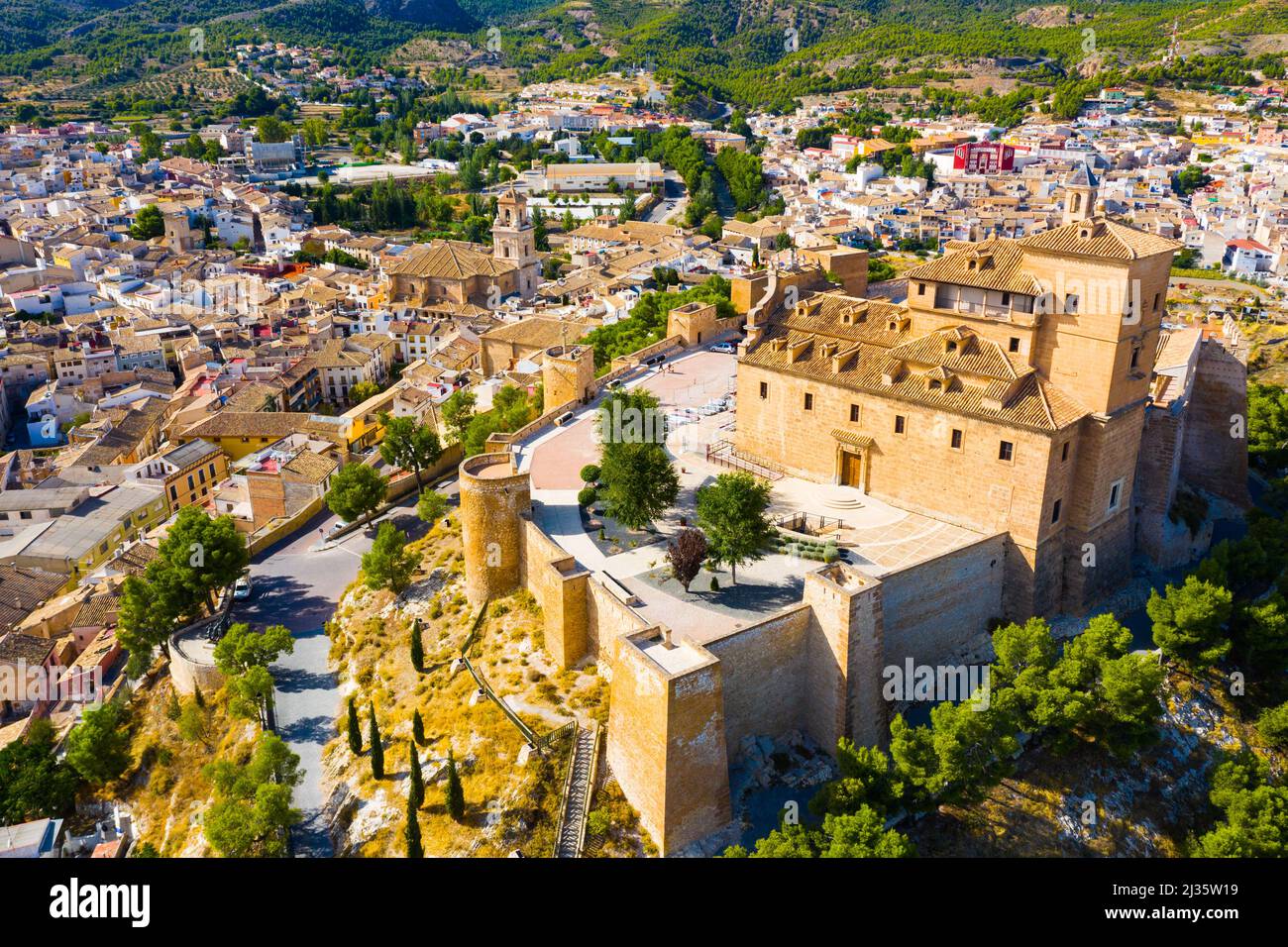 Aerial view of fortified castle and Basilica on hill in Caravaca de la ...