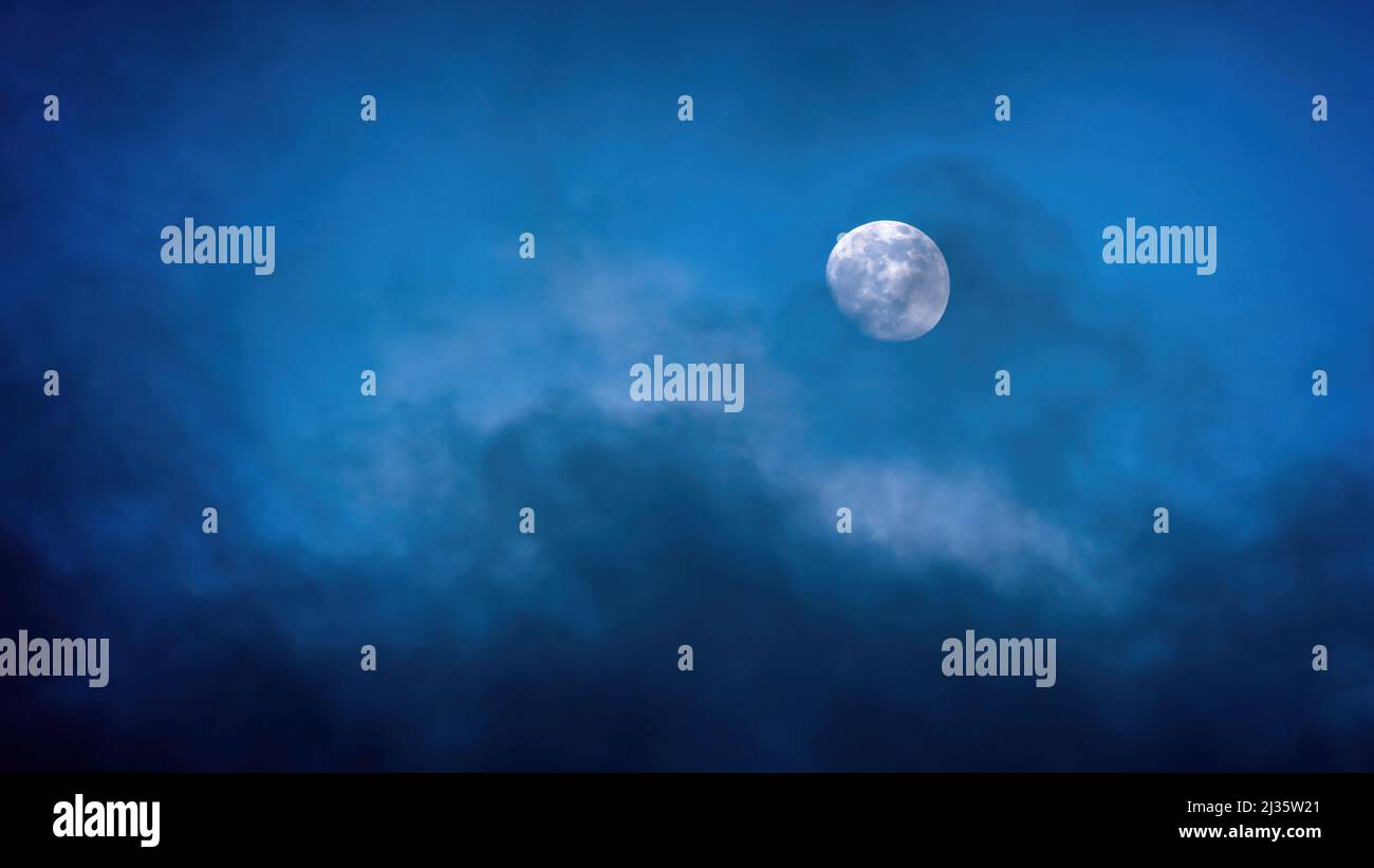 Moon shining through clouds night hi-res stock photography and images - Alamy