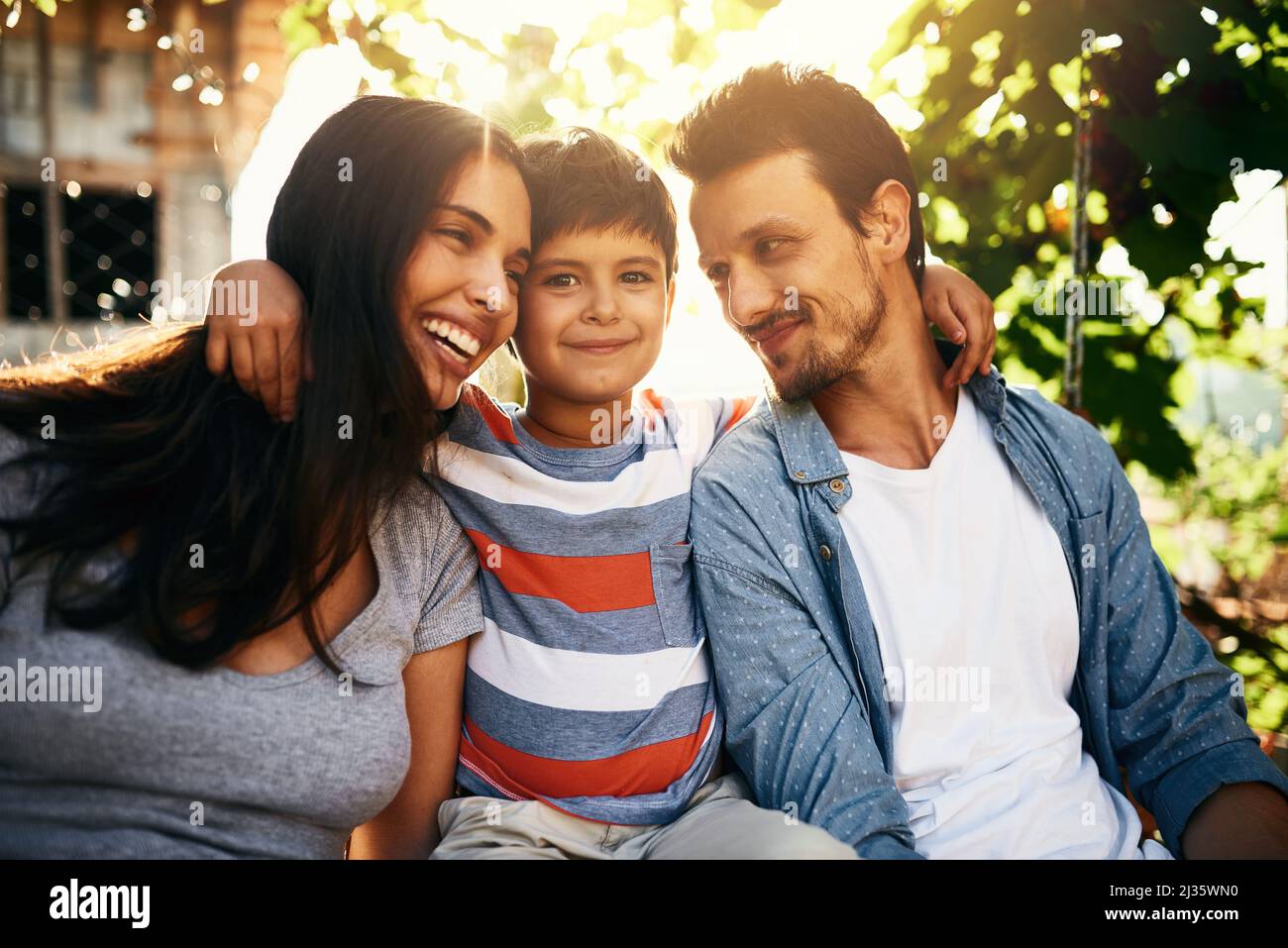 Wedged between his two favourite people in the world. Portrait of an ...