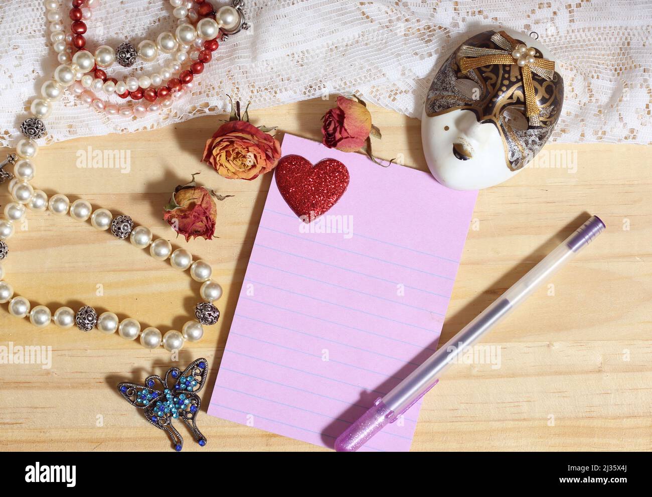 Pearl Jewelry and Butterfly Broach With Lace and Dried Roses on Wooden ...